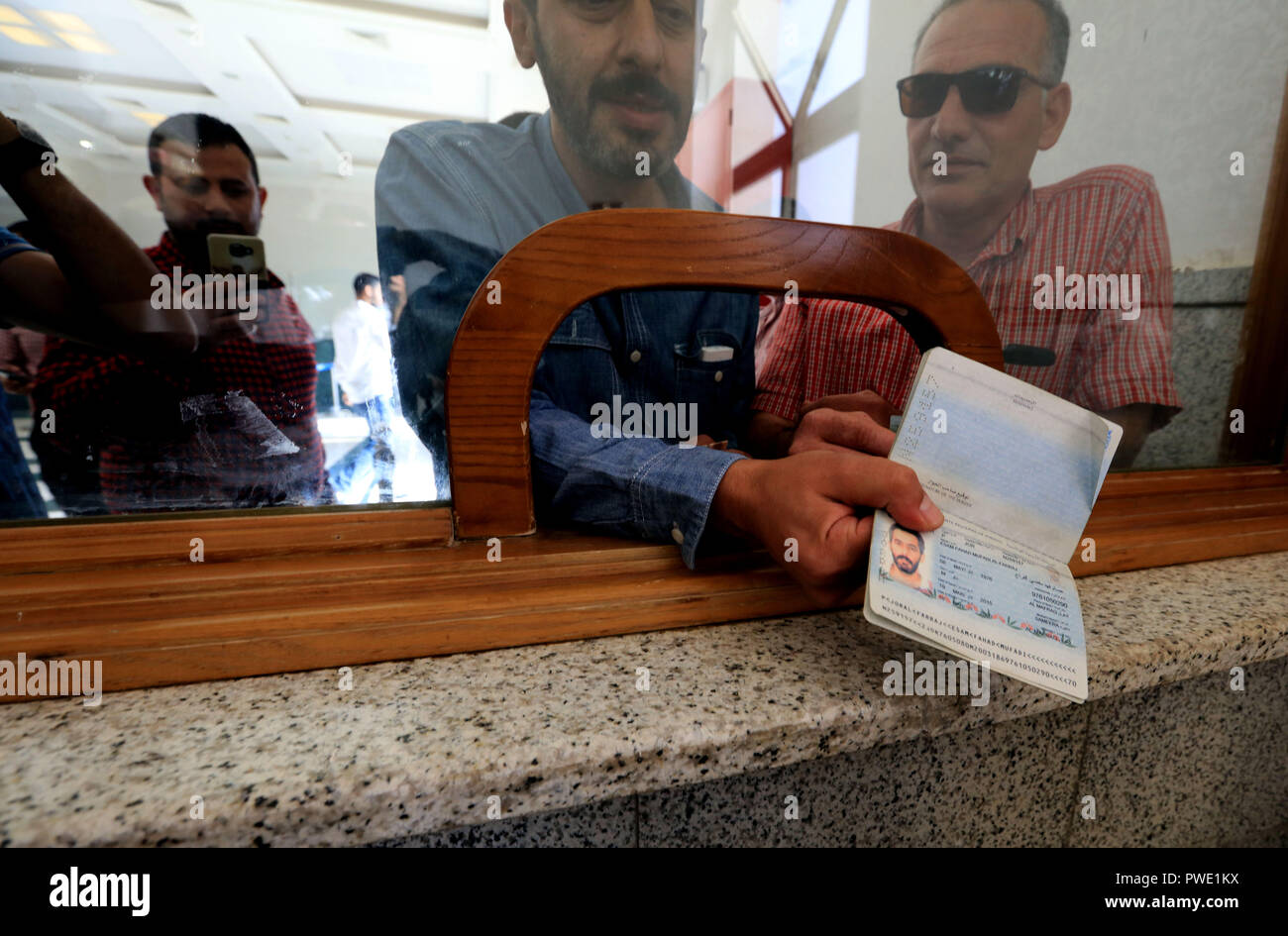 Amman. 15th Oct, 2018. A Jordanian citizen shows his passport at the ...