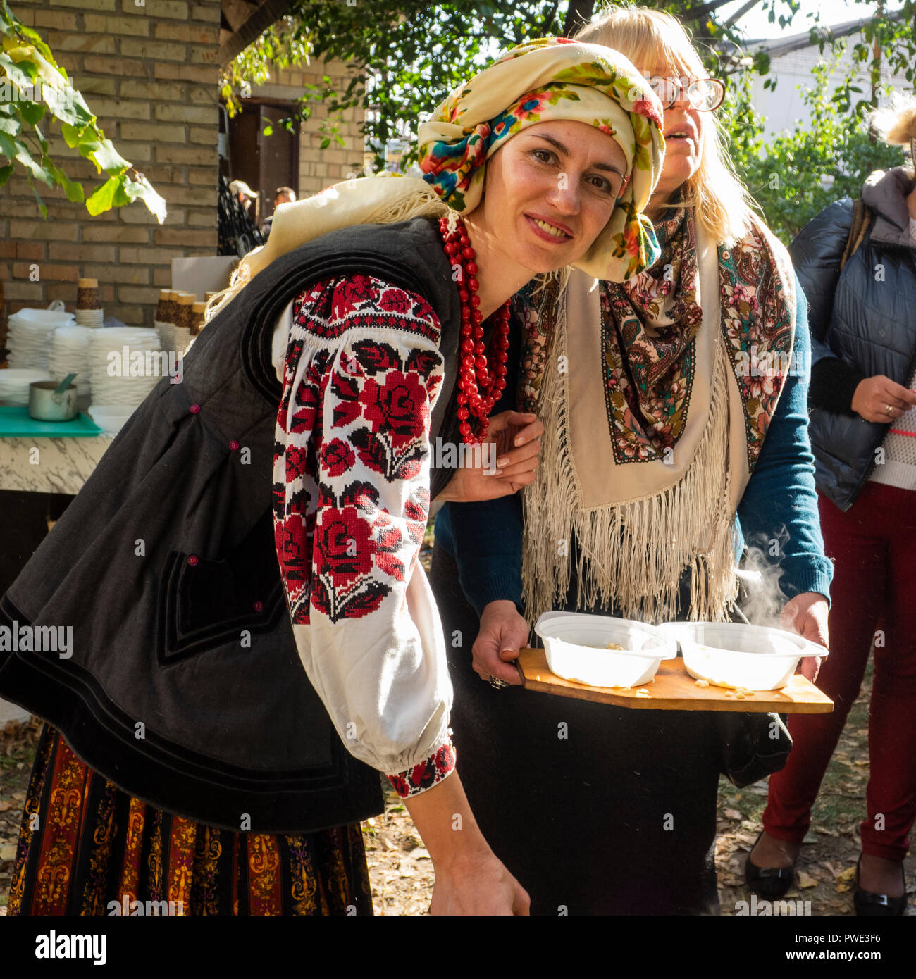 Boryspil, Ukraine. 14th Oct 2018. Women in national costumes treat ...