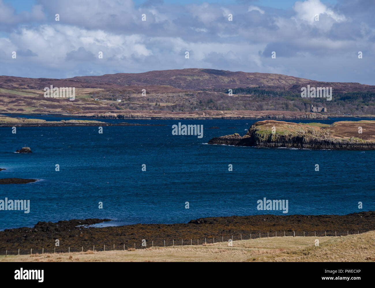 Deep blue bay with islands , Loch Dunvegan, Isle of Skye, Scotland Uk ...