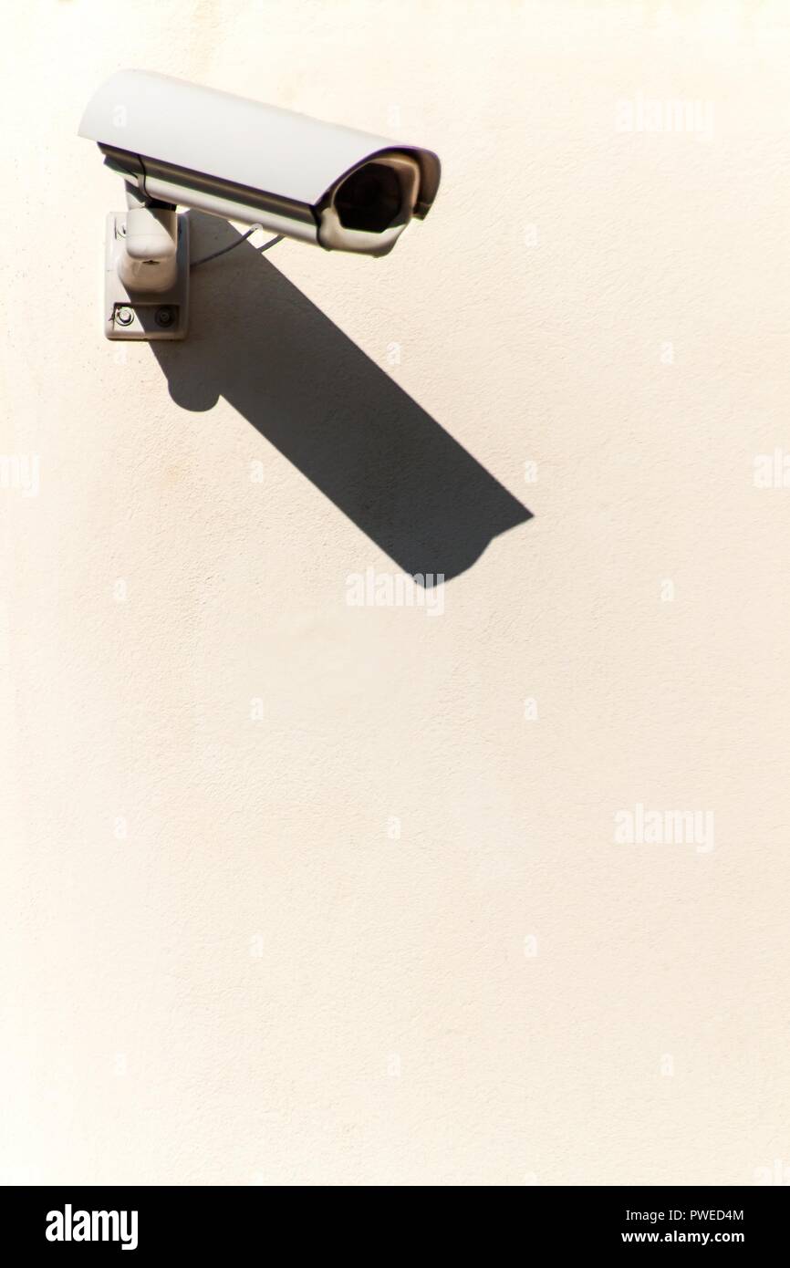 Security camera on the wall. Place for text. Big Brother. Property ...