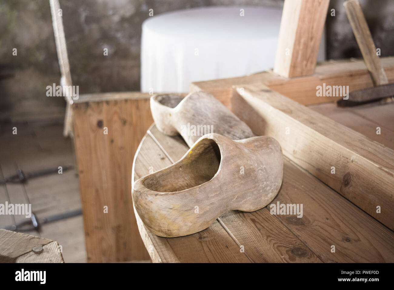 Old wooden shoes on the table. Abstract retro photo Stock Photo - Alamy