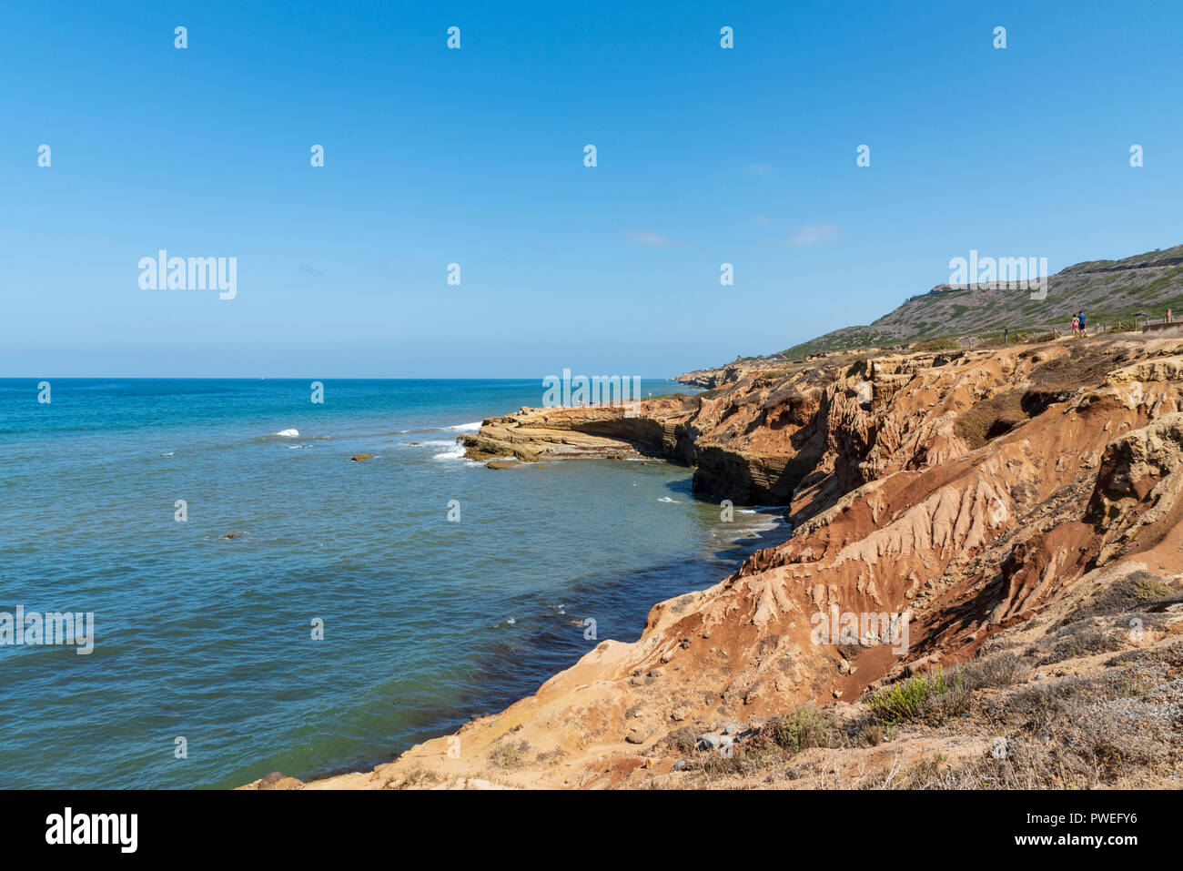California coastline, blue sky, blue ocean and rocky shore Stock Photo ...