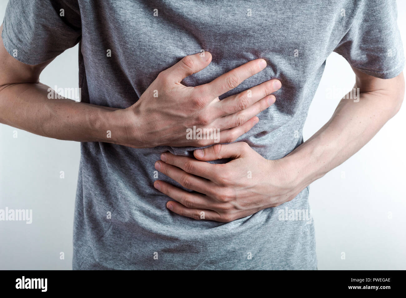 A man suffers from acid reflux in his chest. Heartburn Stock Photo - Alamy