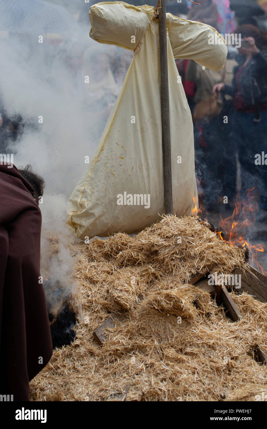 Man wearing a medieval costume is building a campfire Stock Photo - Alamy