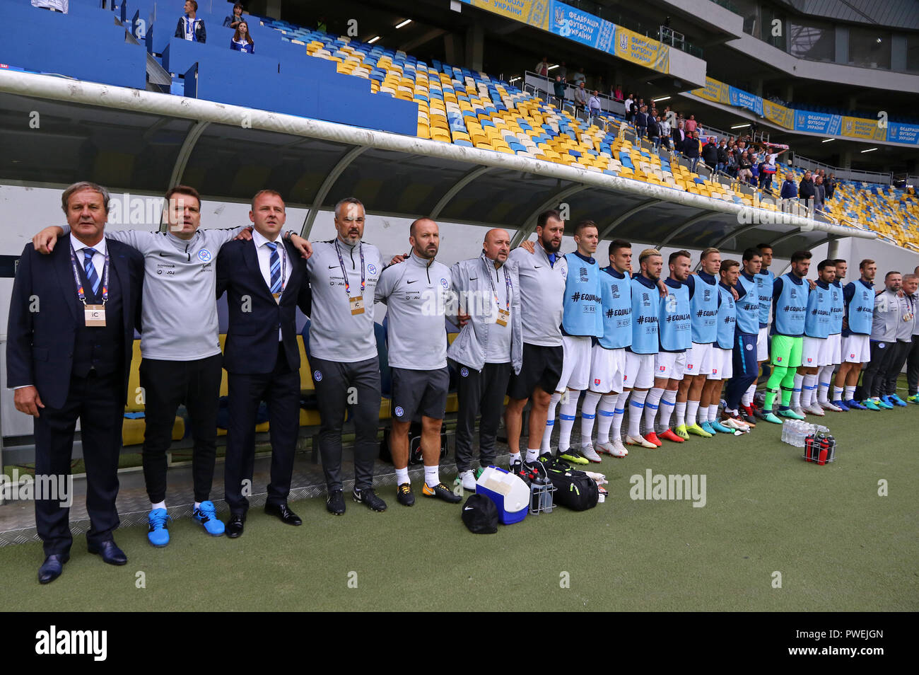 Slovak coaches and bench players listen to the National Anthem before ...