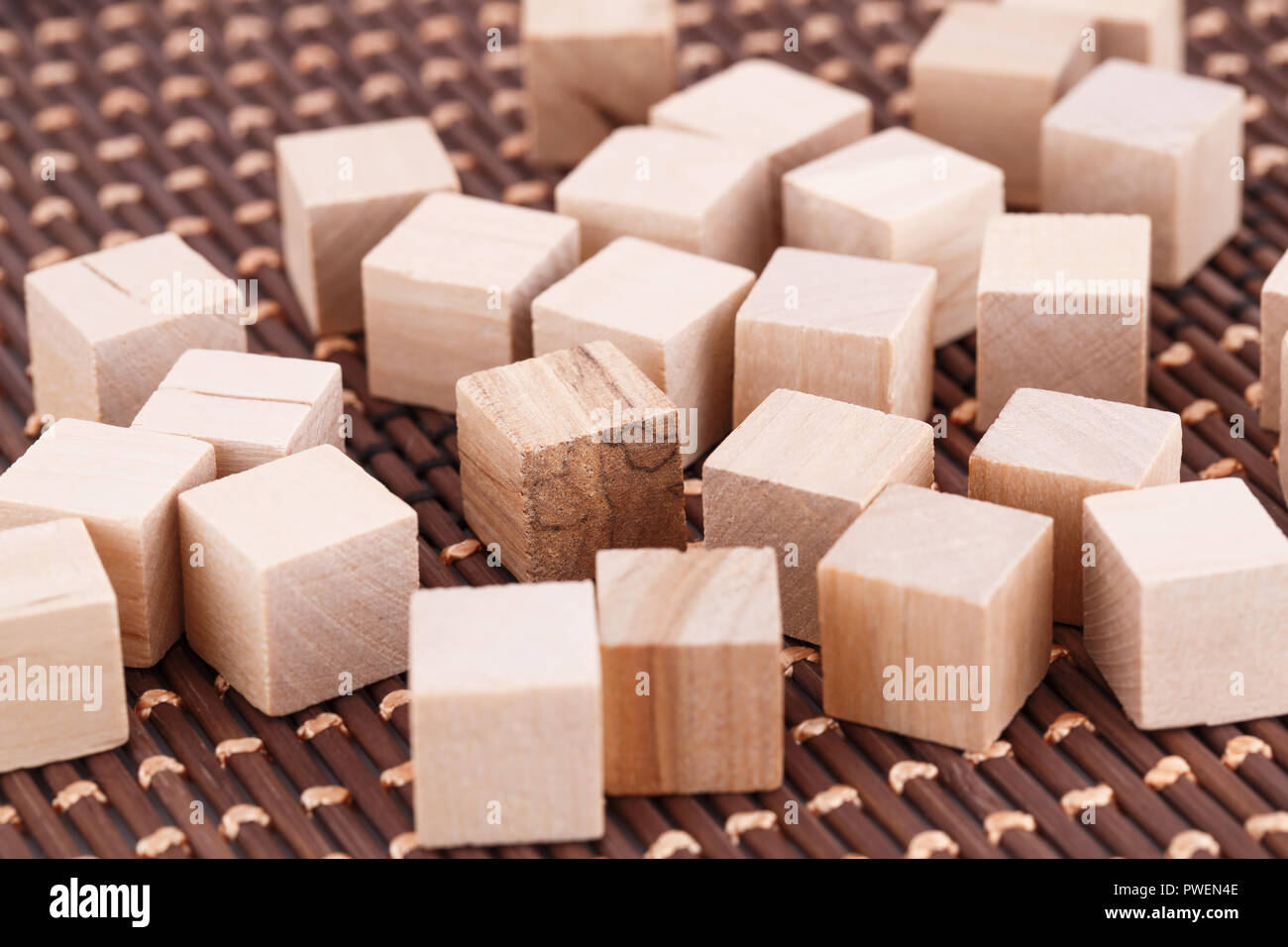 Wooden cubes on brown bamboo background Stock Photo - Alamy