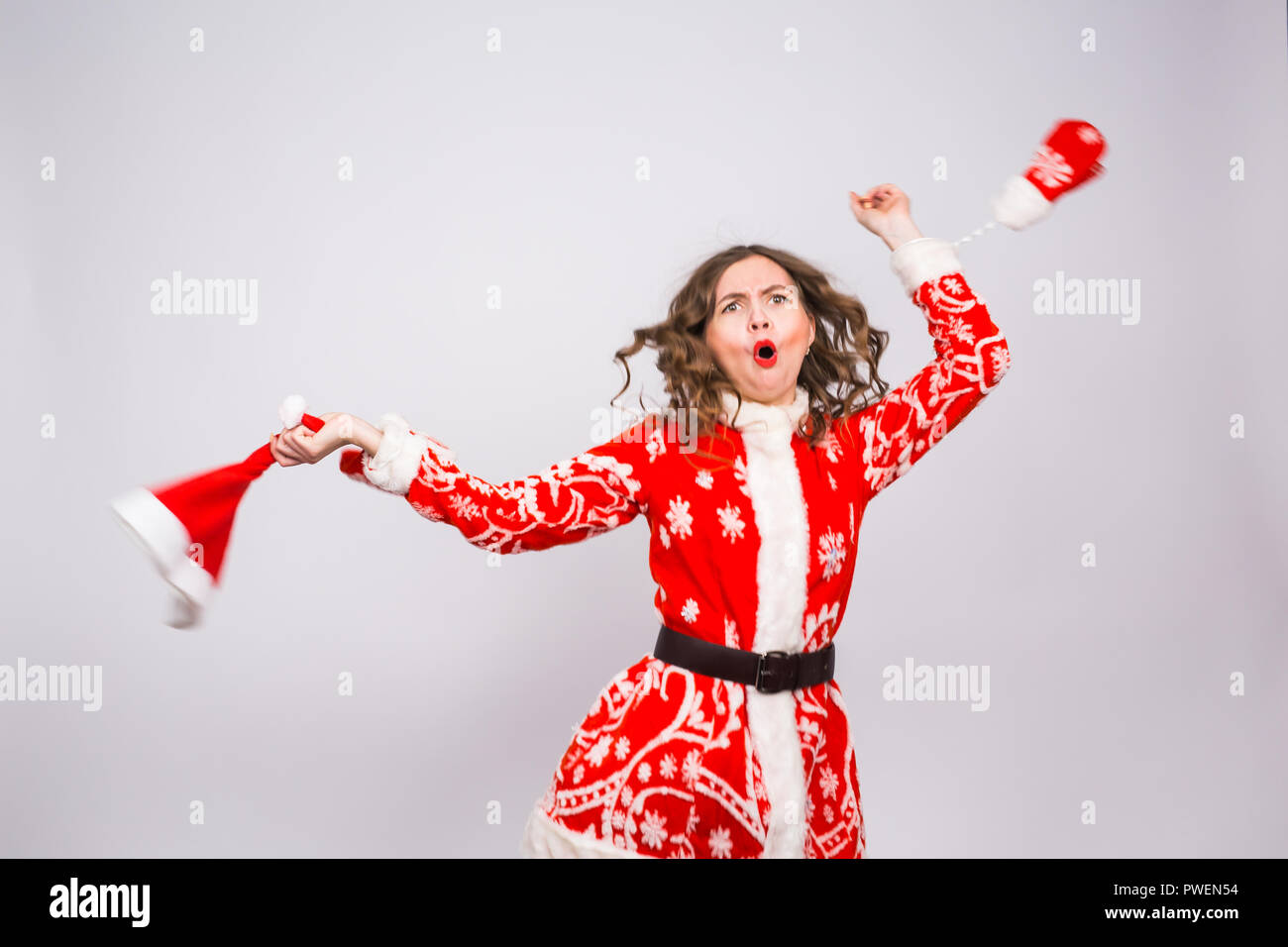 Christmas, people concept - woman in santa suit took off hat and having ...