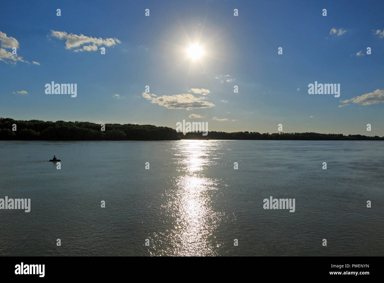 sunset, backlight, reflection on the water surface, Danube landscape ...