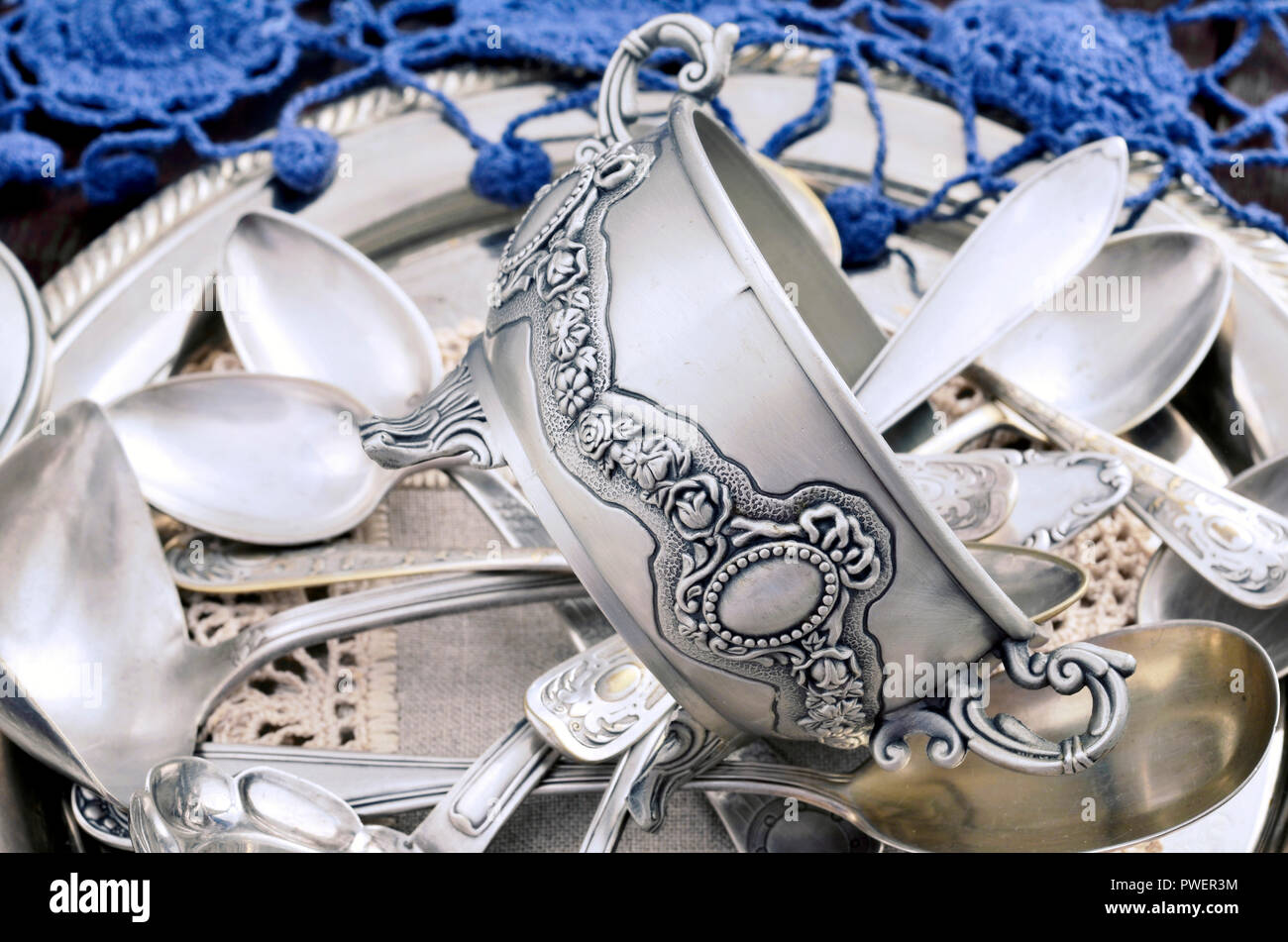 vintage old silverware in a silver tray close-up Stock Photo - Alamy