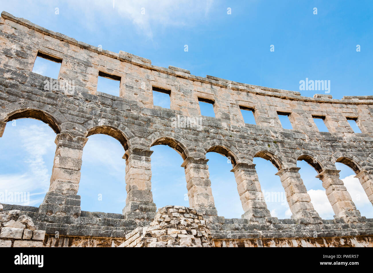 Pula, Croatia - June 18, 2014: Stone arc columns rows in Pula Arena ...