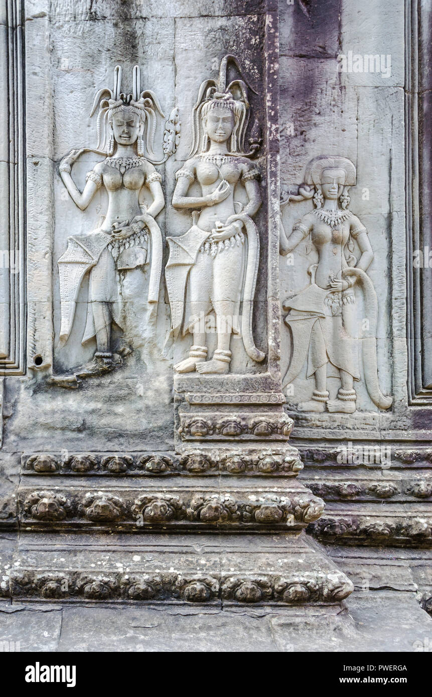 Bas-relief showing devatas, the female divine carved figurines, with ...
