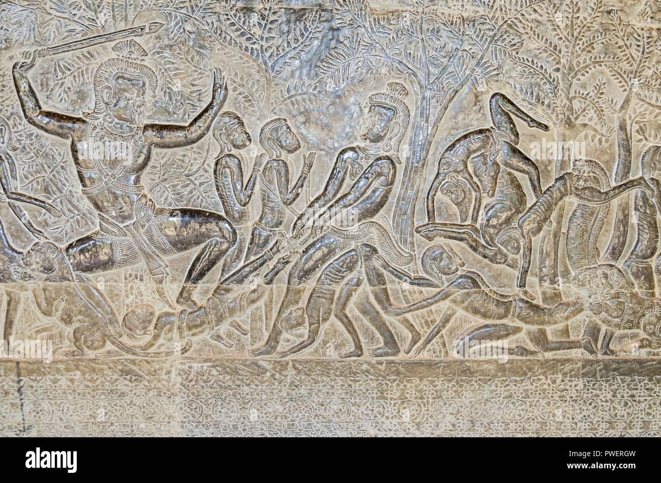 The wall of one of the galleries of Angkor Wat with its linear ...