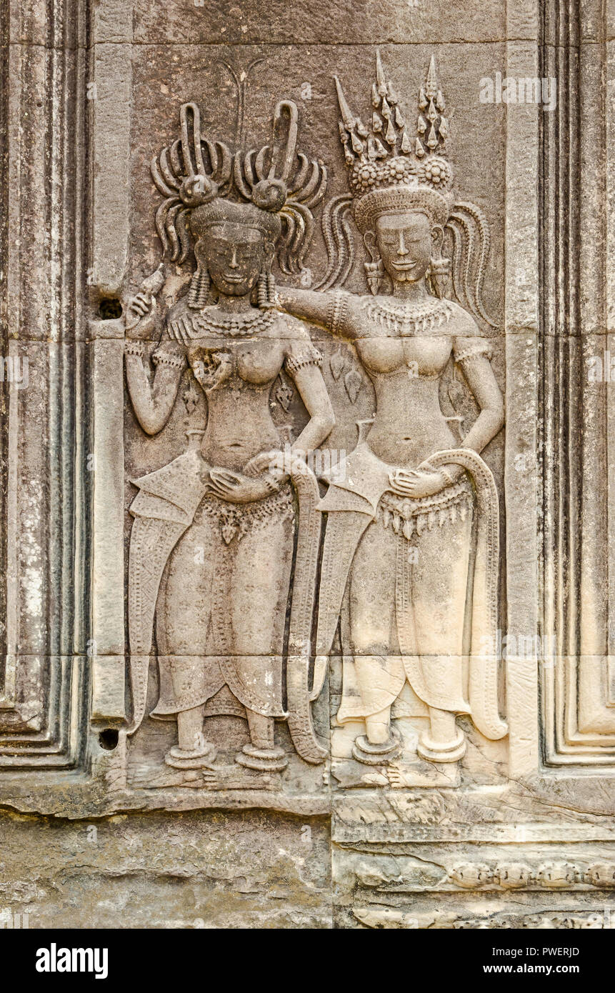 Bas-relief showing devatas, the female divine carved figurines, with ...
