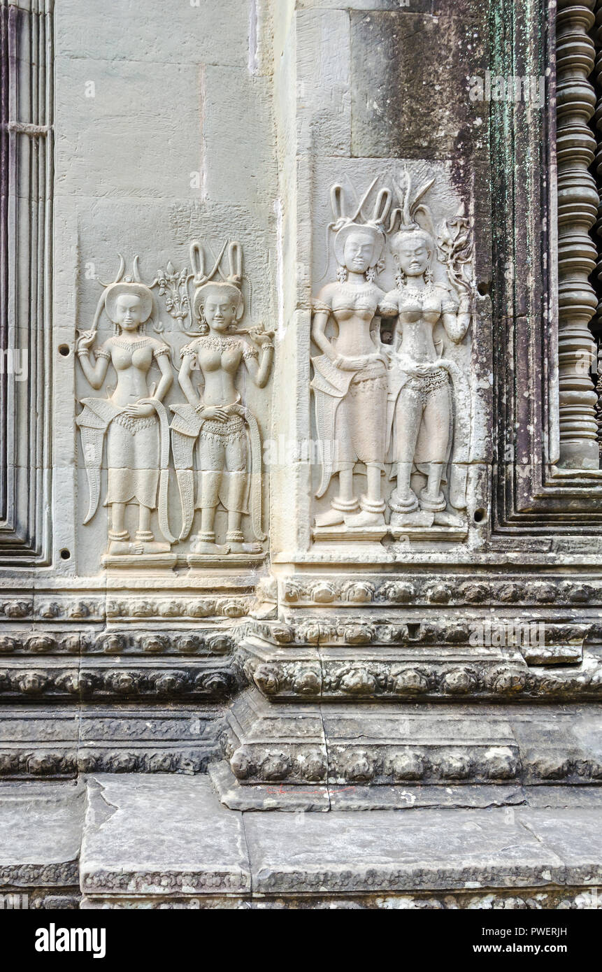 Bas-relief showing devatas, the female divine carved figurines, with ...