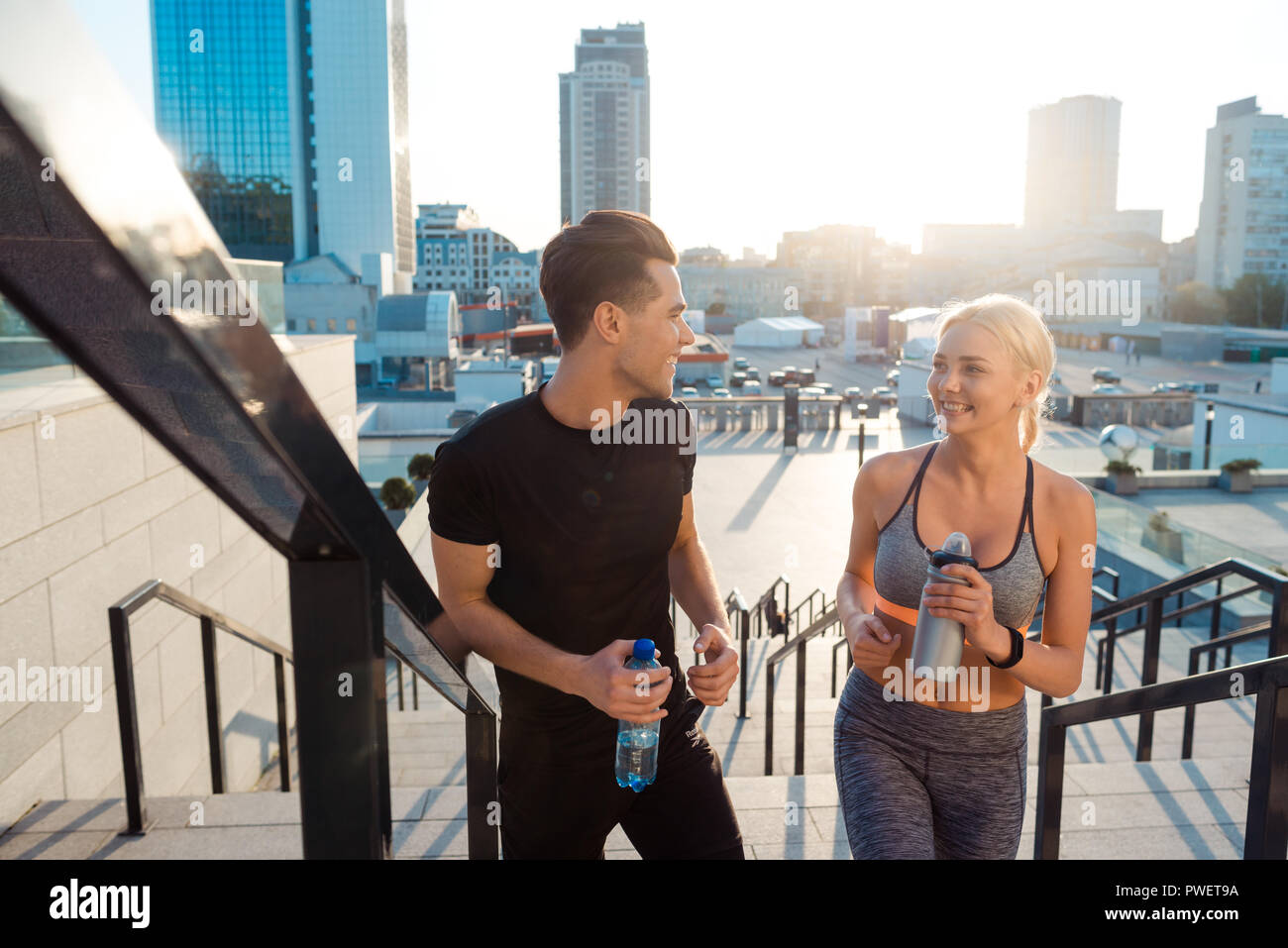 Fit couple is going up Stock Photo - Alamy