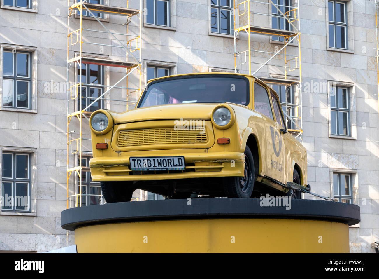 A Trabant car at the Berlin Wall which separated East and West Germany ...