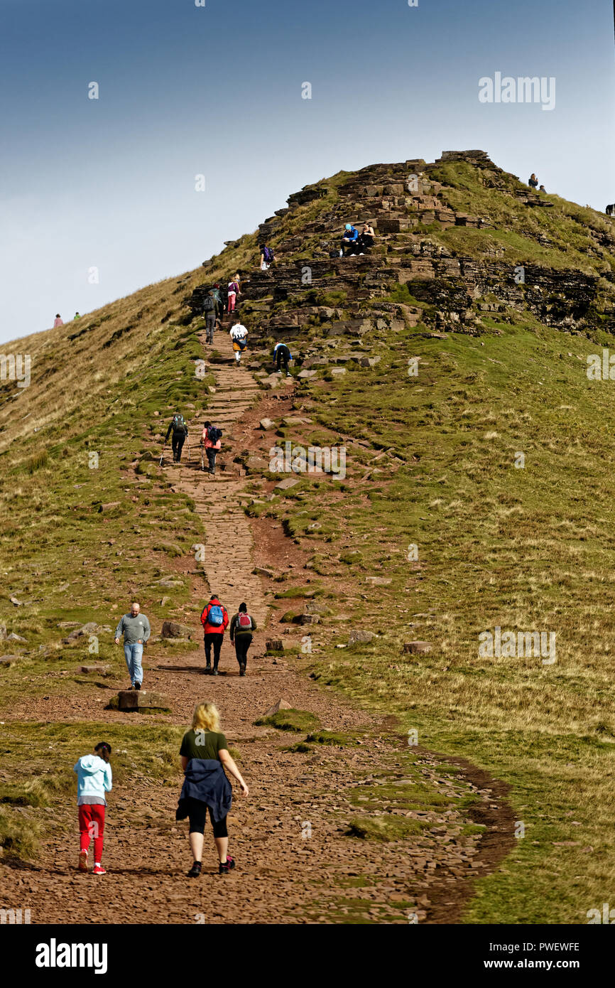 Pictured: People walk the path towards the summit of Corn Du in the ...