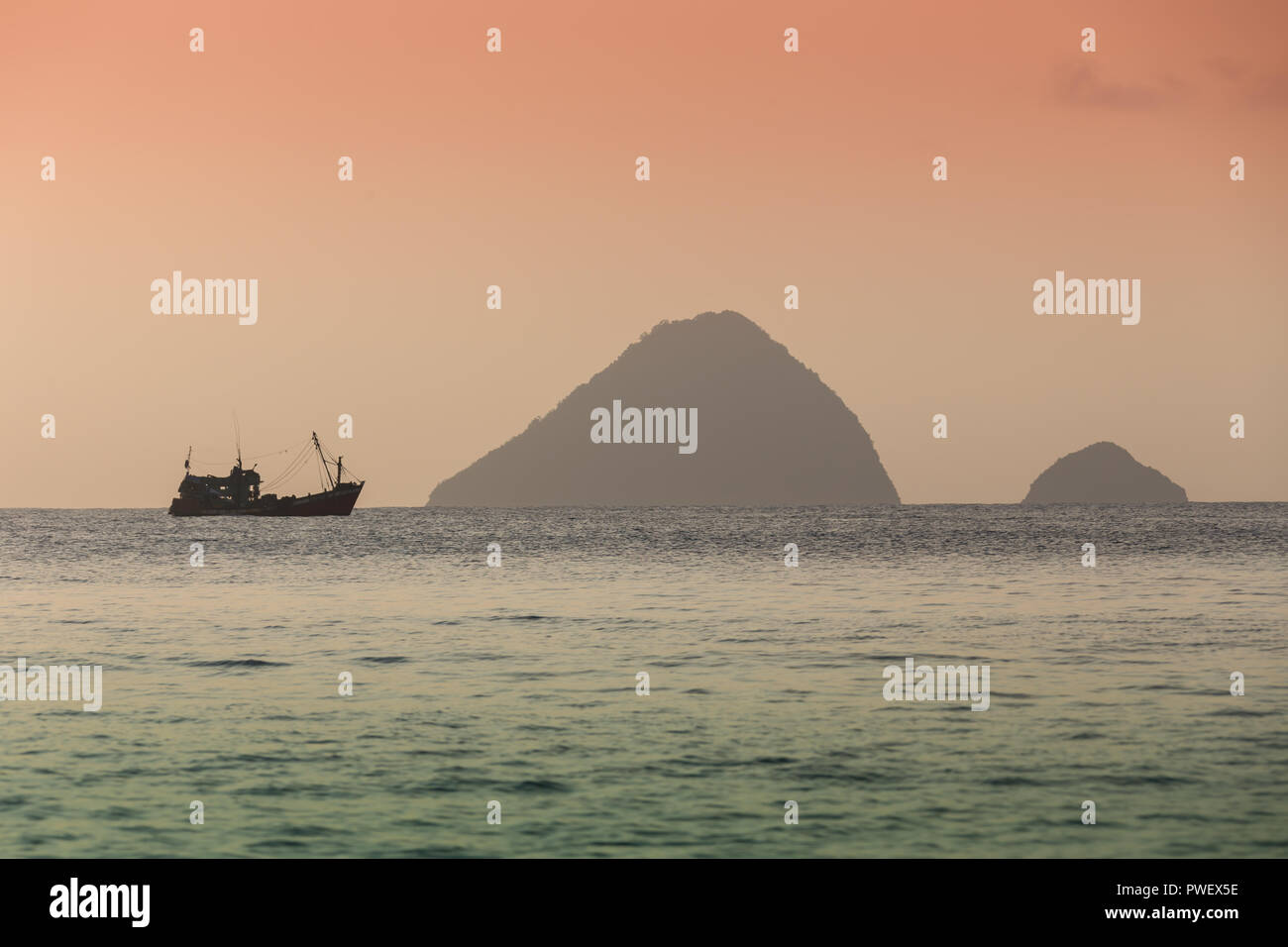 Beautiful sunset view of surf at beach Stock Photo - Alamy