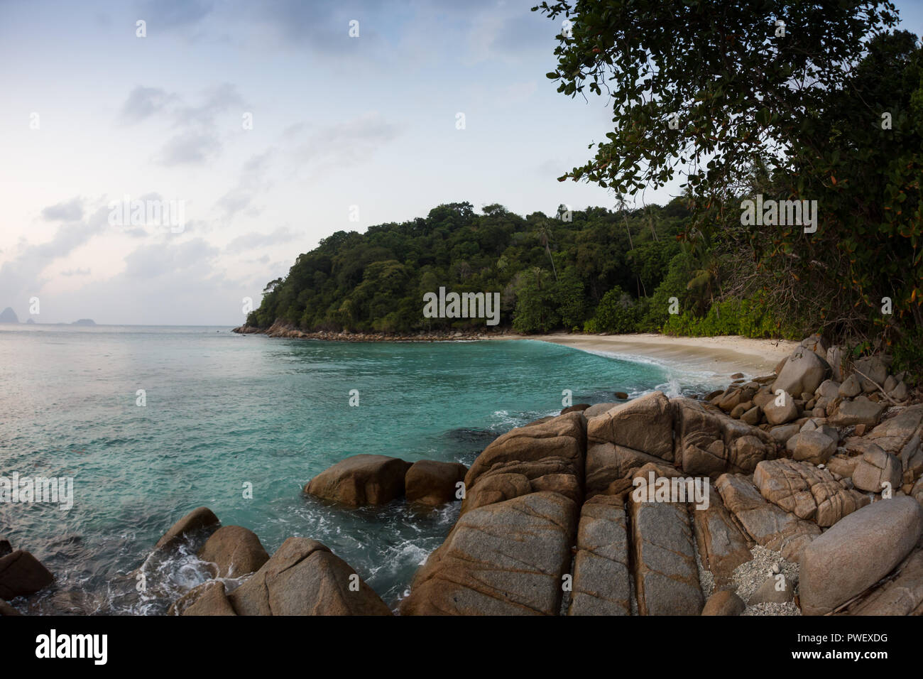 Sea waves lash line impact rock on the beach Stock Photo - Alamy