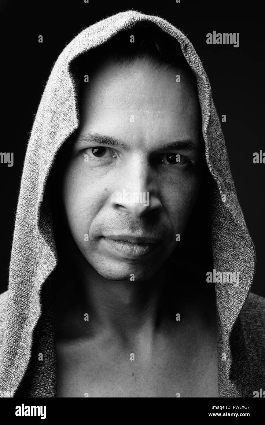 Rebellious man against black background in black and white Stock Photo ...