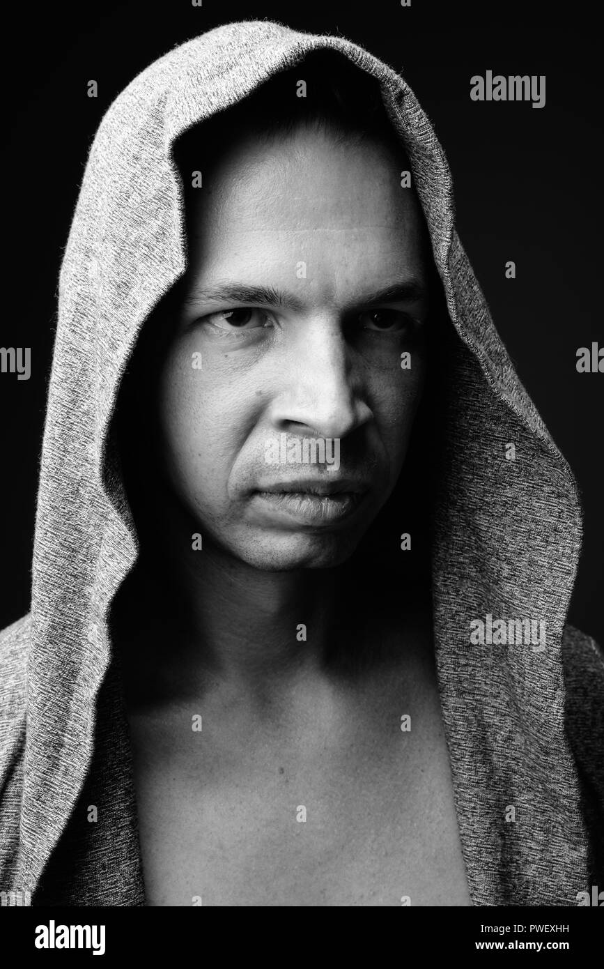 Rebellious man against black background in black and white Stock Photo ...