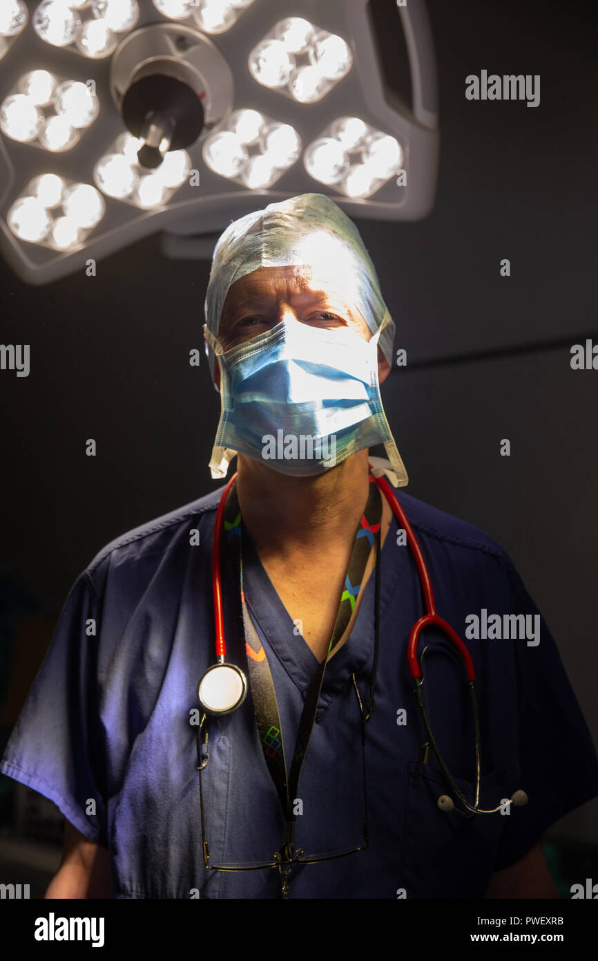 Patient's eye view of a surgeon in a hospital operating theatre Stock ...