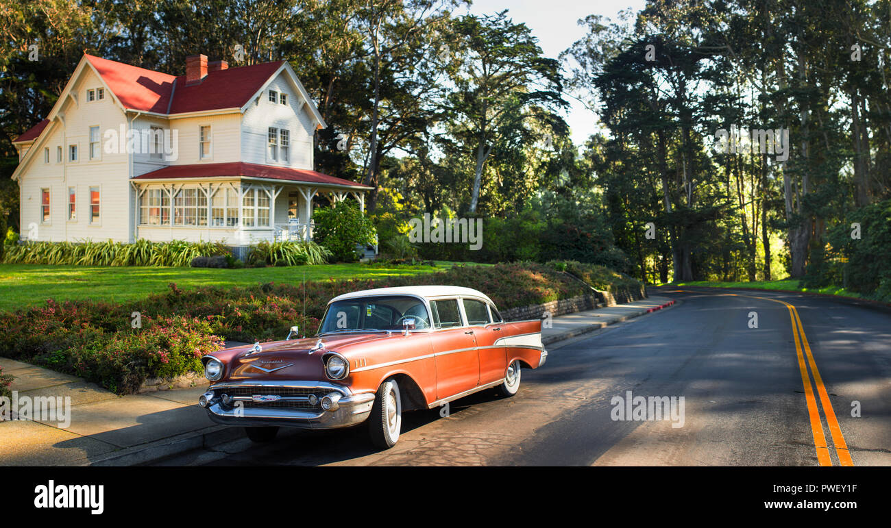 Vintage car parked outside a suburban house Stock Photo - Alamy