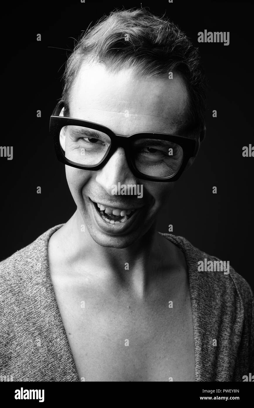 Rebellious man against black background in black and white Stock Photo ...