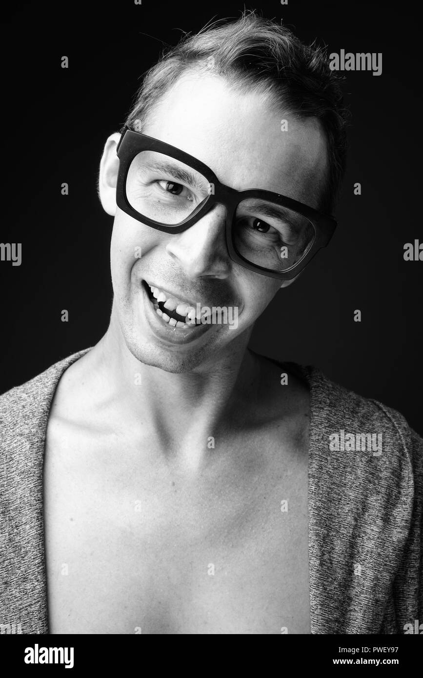 Rebellious man against black background in black and white Stock Photo ...