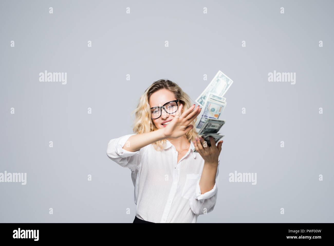 Happy fancy woman spend money of dollars isolated on white Stock Photo ...