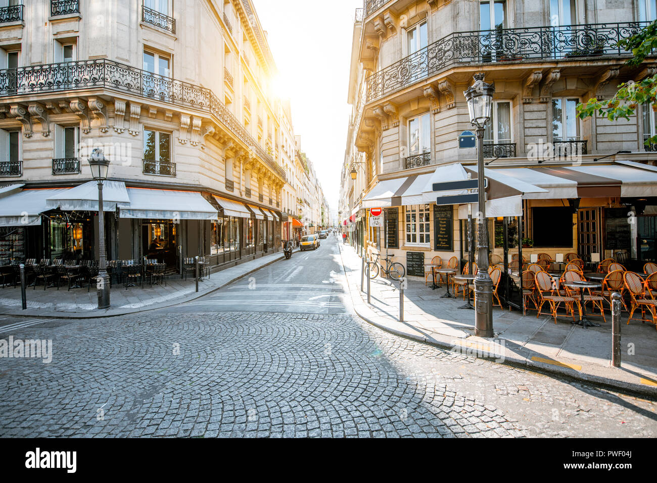 Street view with beautiful buildings and cafe terrace during the ...