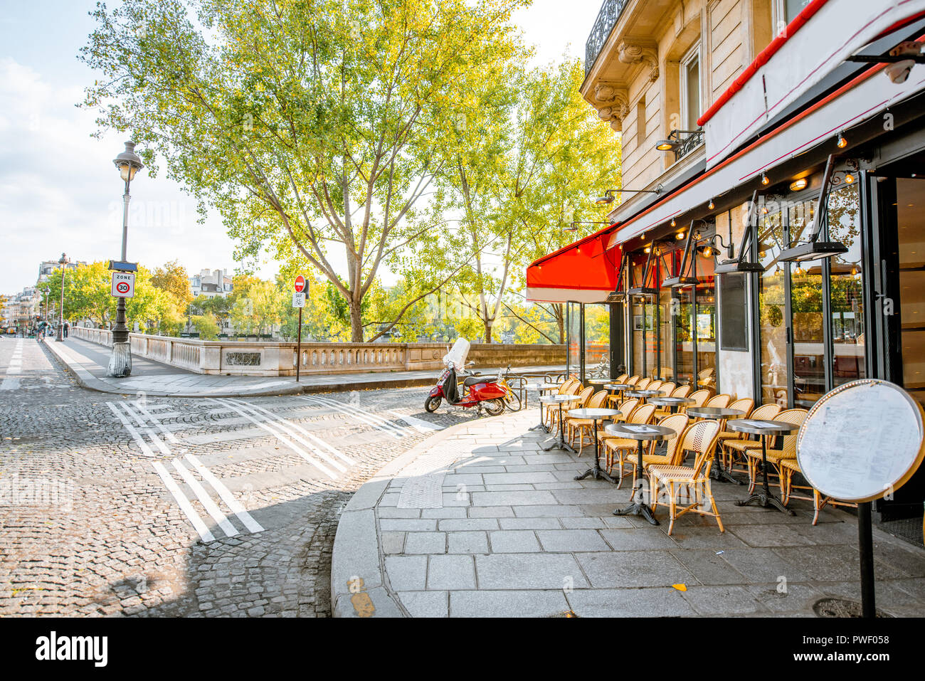 Street view with beautiful buildings and cafe terrace during the ...