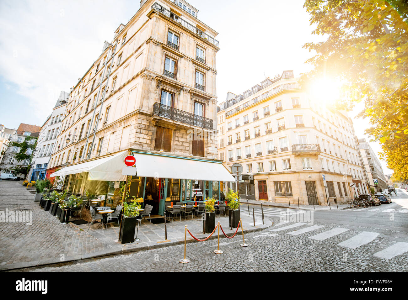 Street view with beautiful buildings and cafe terrace during the ...