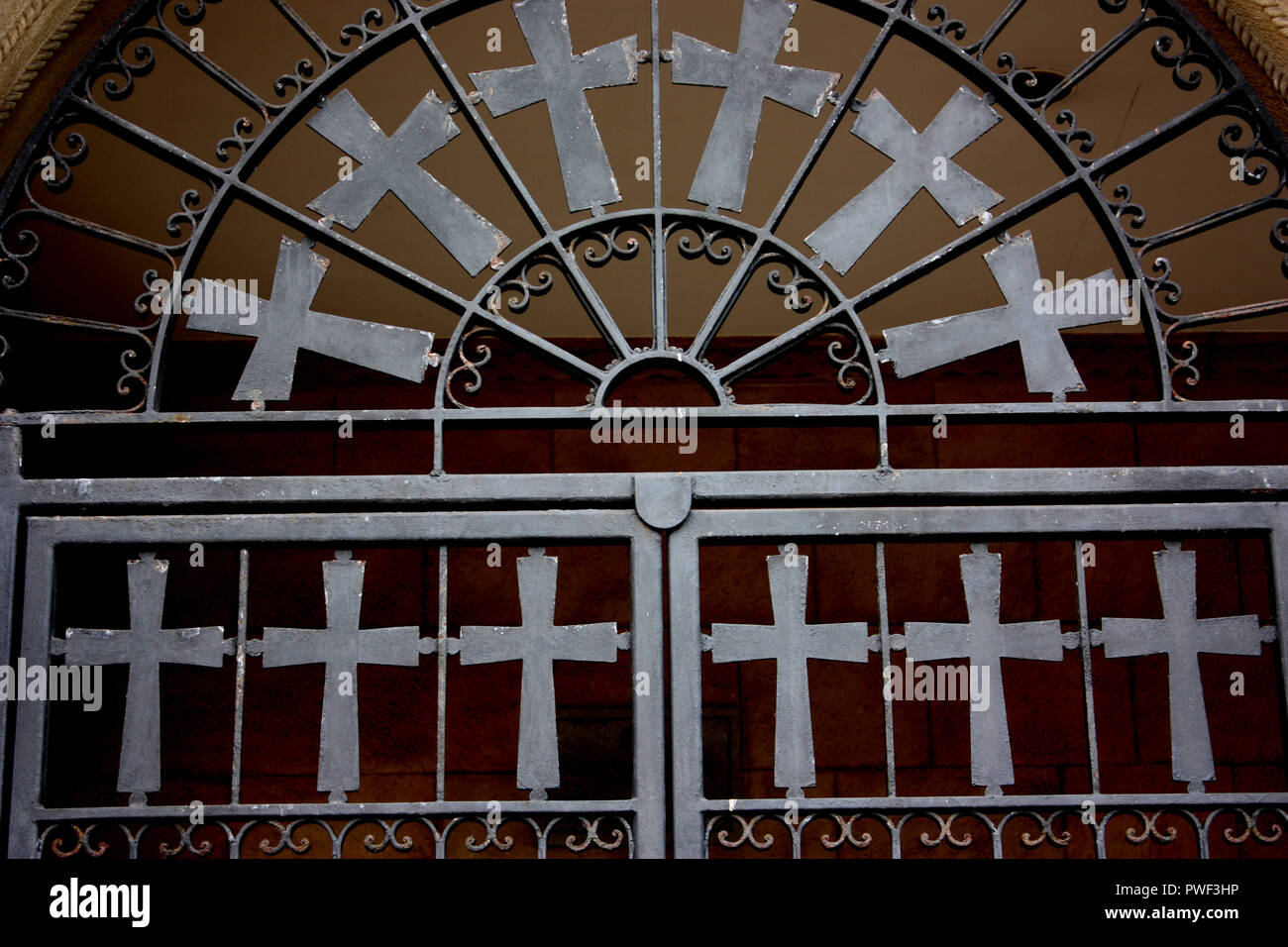 Architectural details such as windows, grilles, and cross-key motifs on ...