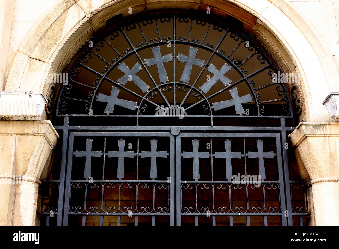 Architectural details such as windows, grilles, and cross-key motifs on ...