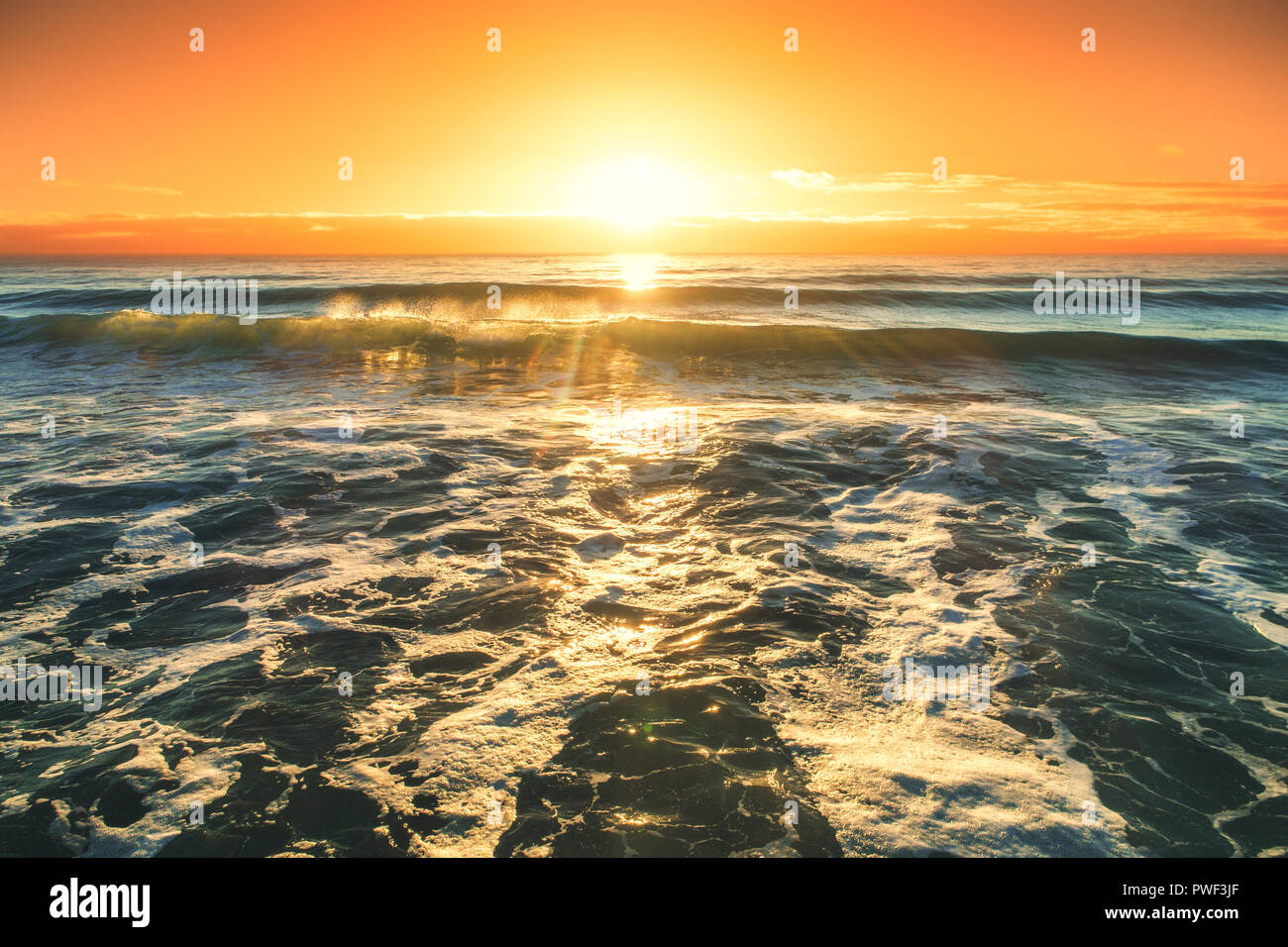 Aerial view of ocean waves at sunrise Stock Photo - Alamy