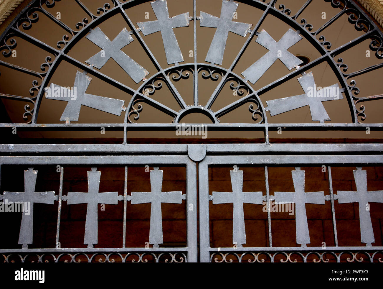 Architectural details such as windows, grilles, and cross-key motifs on ...