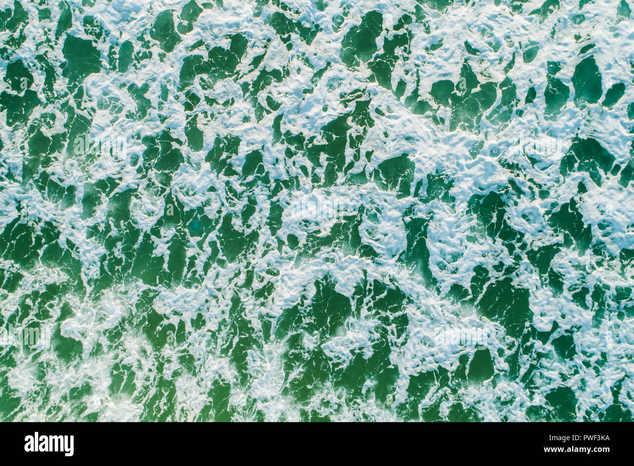 Texture of ocean wave. Sunrise shot Stock Photo - Alamy