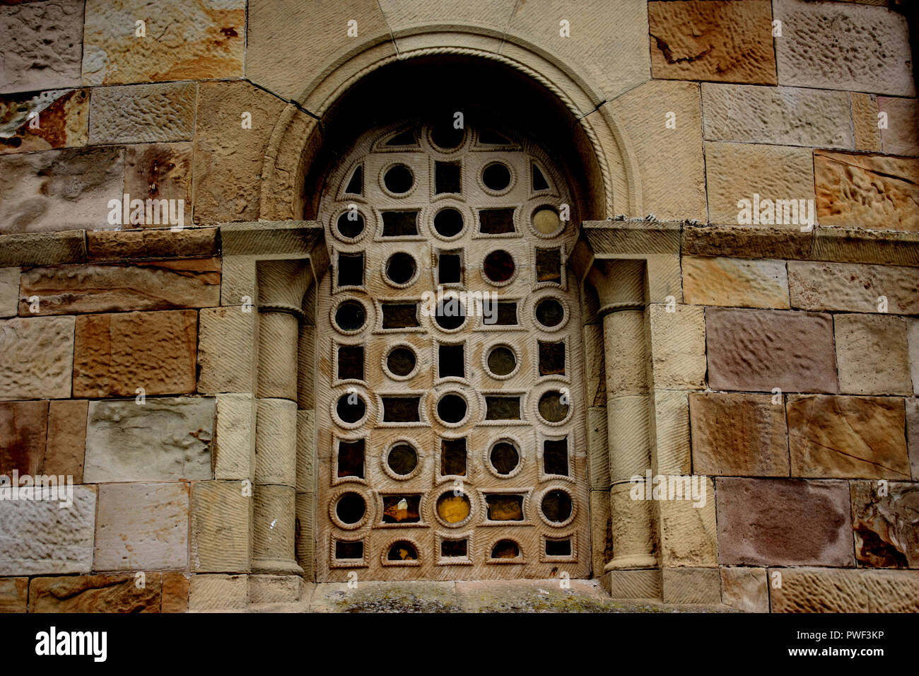 Architectural details such as windows, grilles, and cross-key motifs on ...