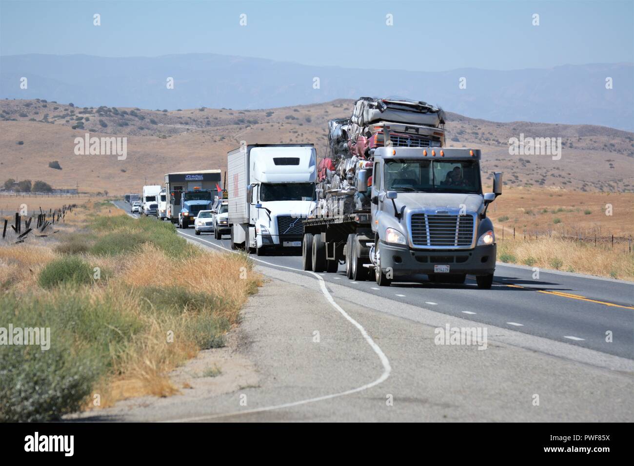 Trucks moving goods to a market or office Stock Photo - Alamy