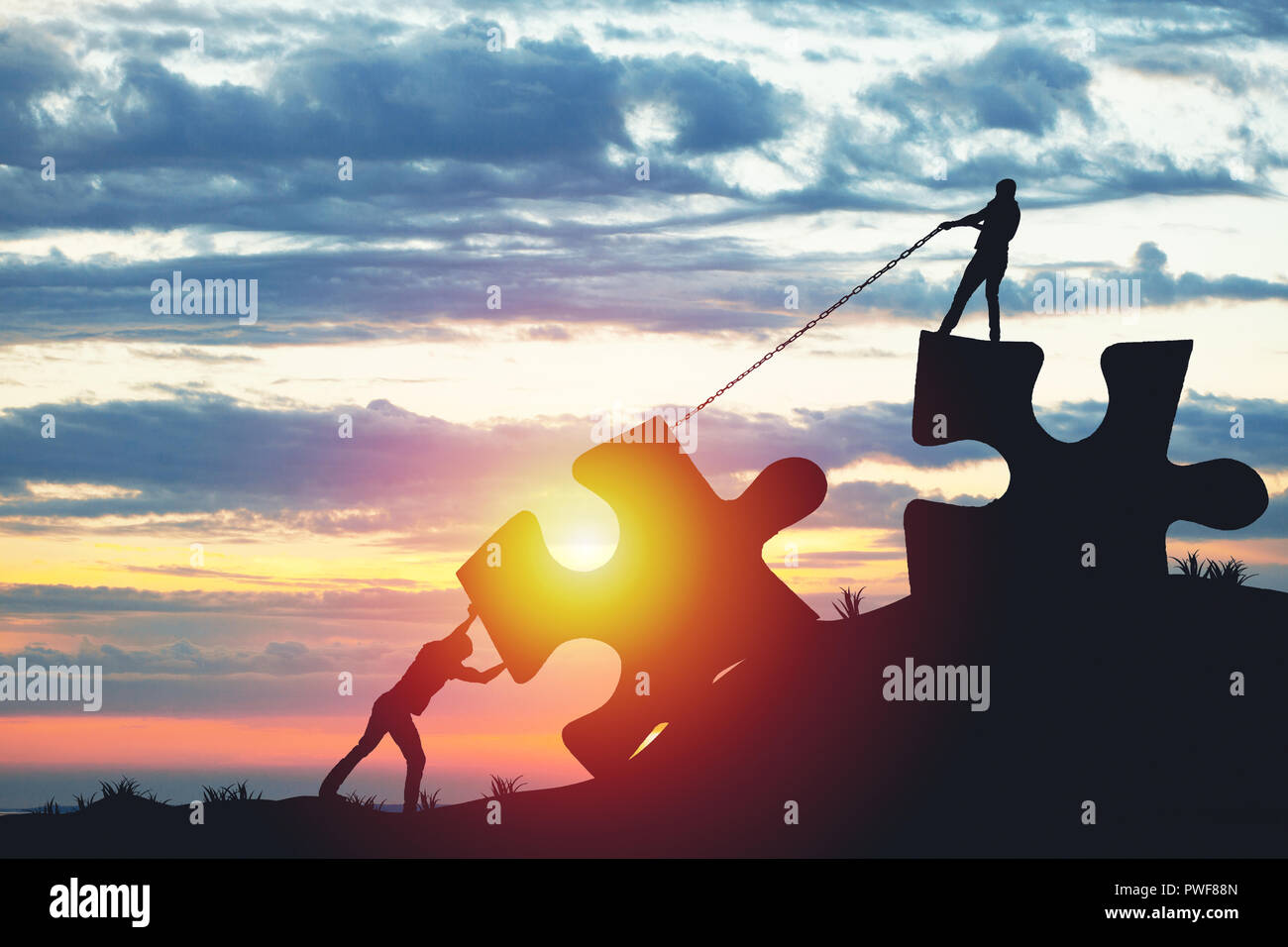 People putting together puzzle hi-res stock photography and images - Alamy