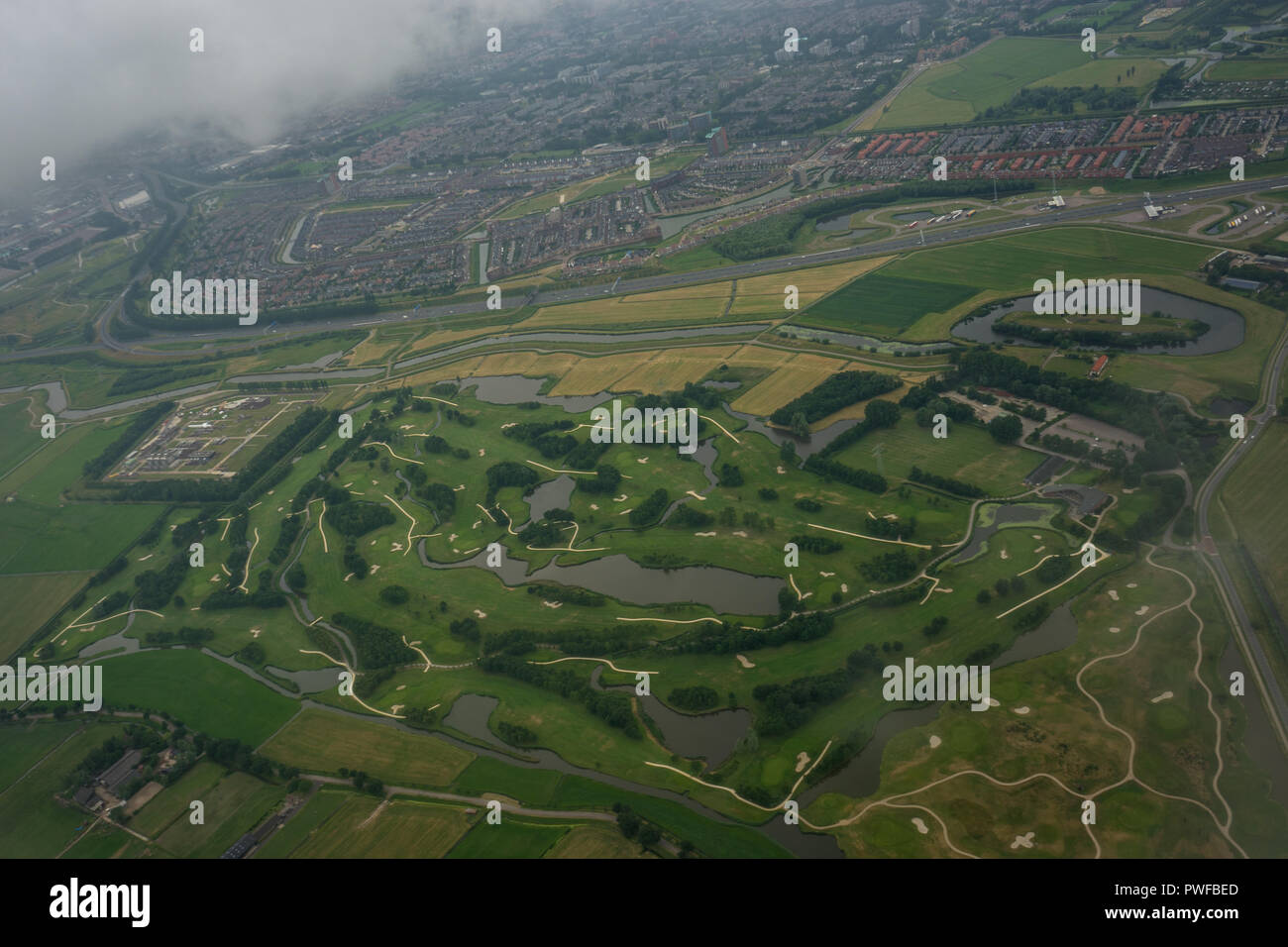 the golf course viewed from the sky from a window in a plan, holland ...