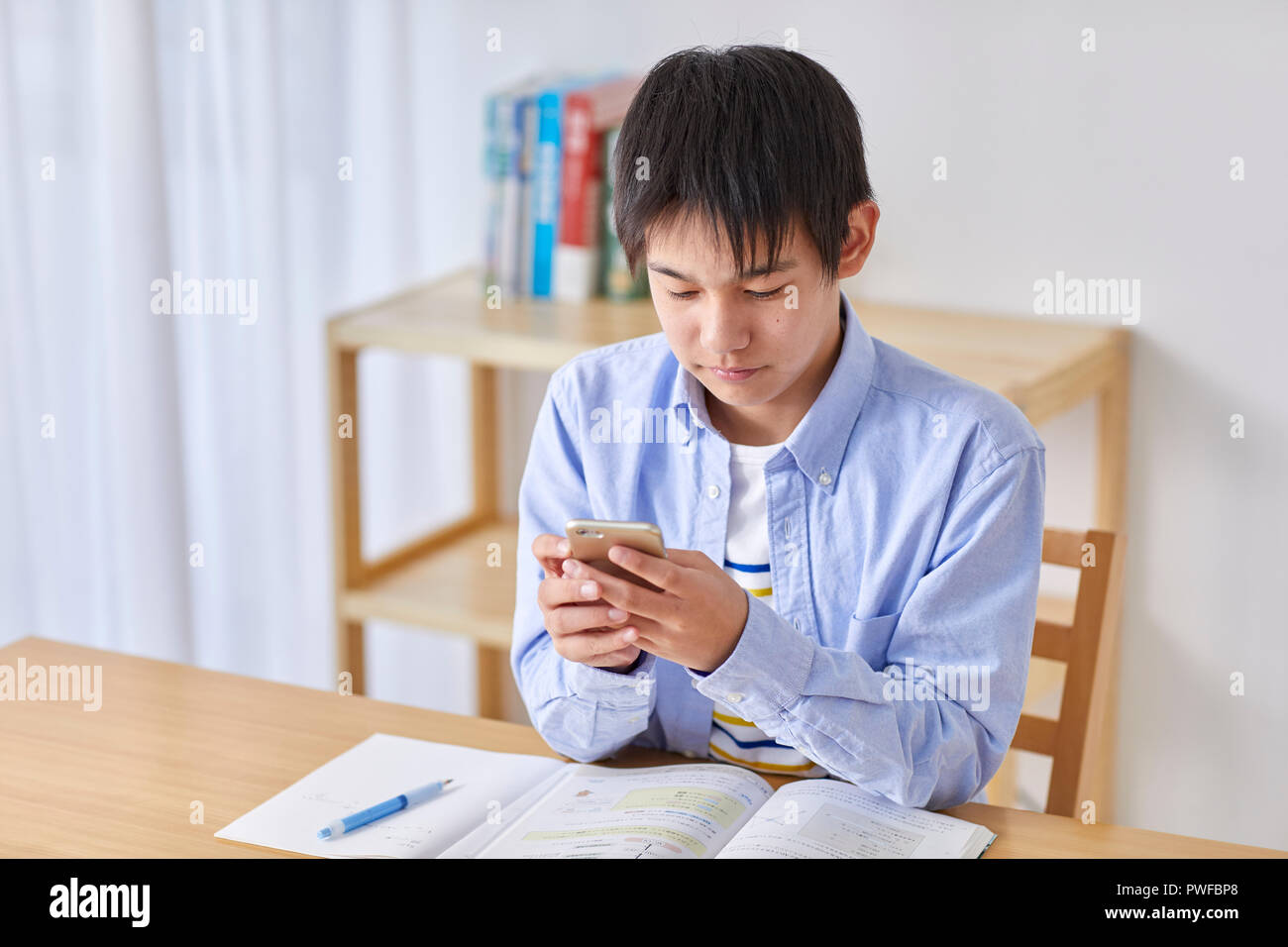 Japanese kid studying at home Stock Photo - Alamy
