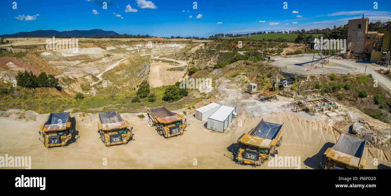 Aerial landscape of heavy industrial machinery and old limestone mine ...