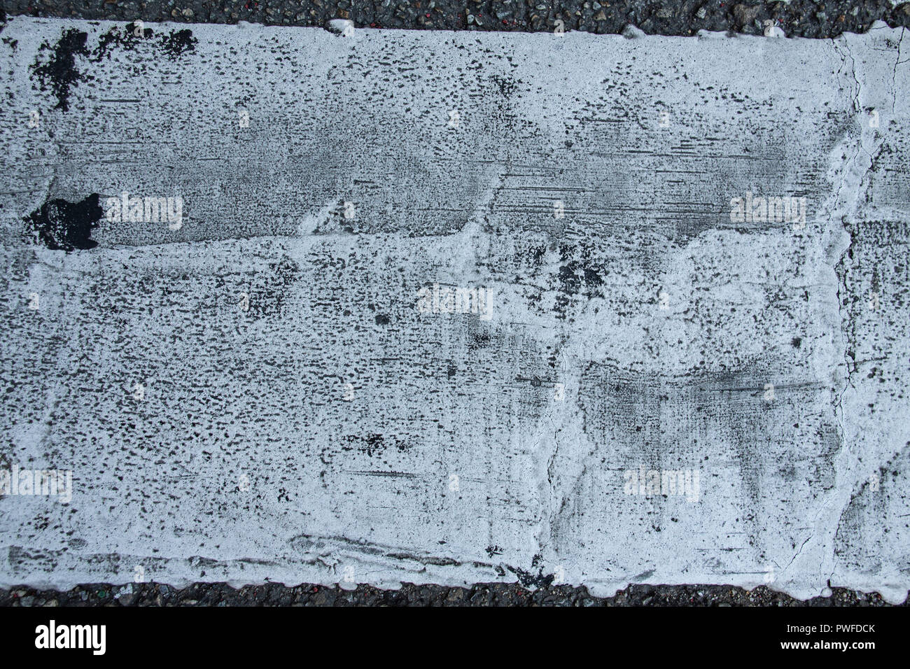 White road marking painted on asphalt road Stock Photo - Alamy