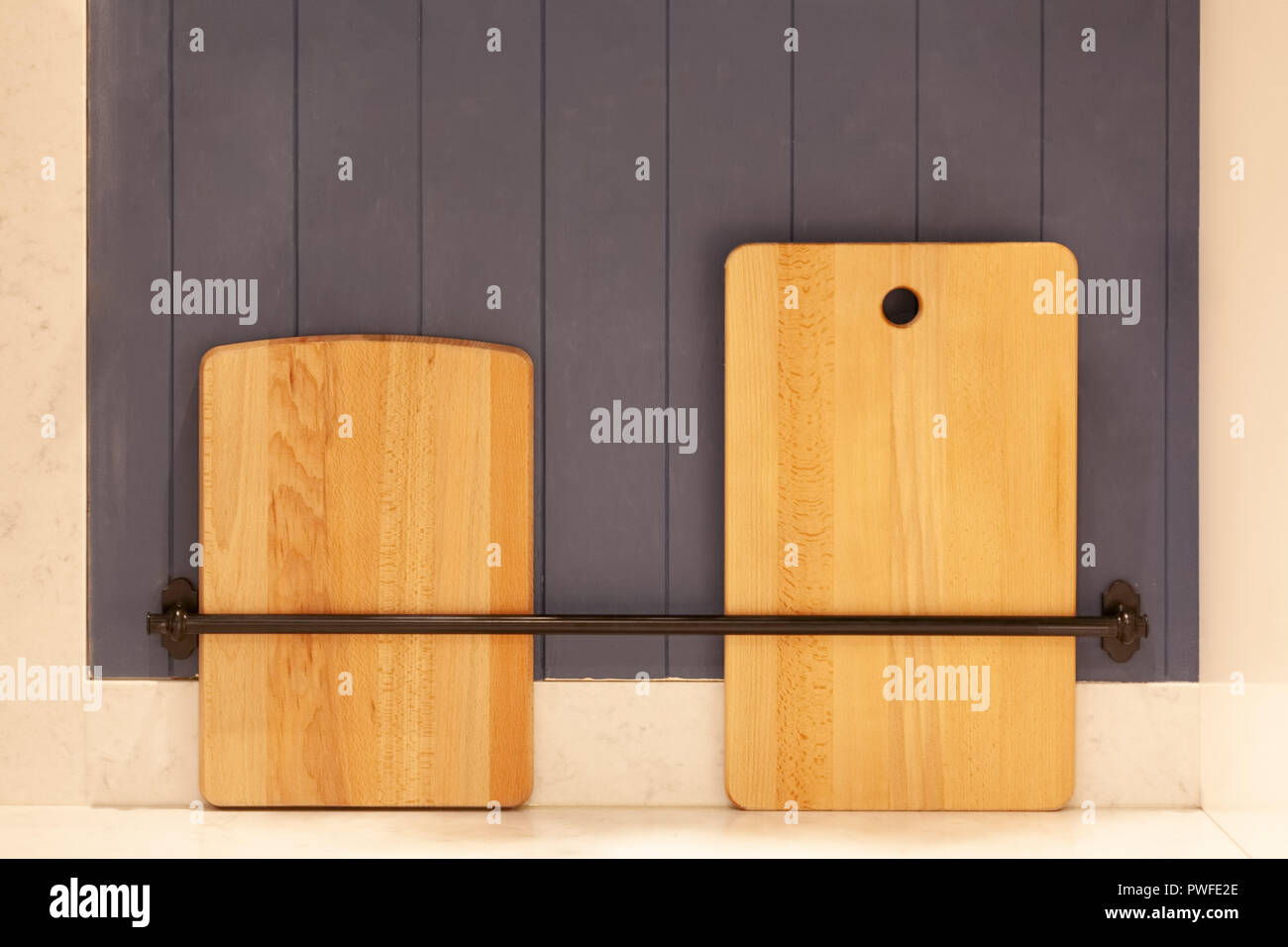 Two kitchen chopping boards placed vertically on benchtop Stock Photo ...