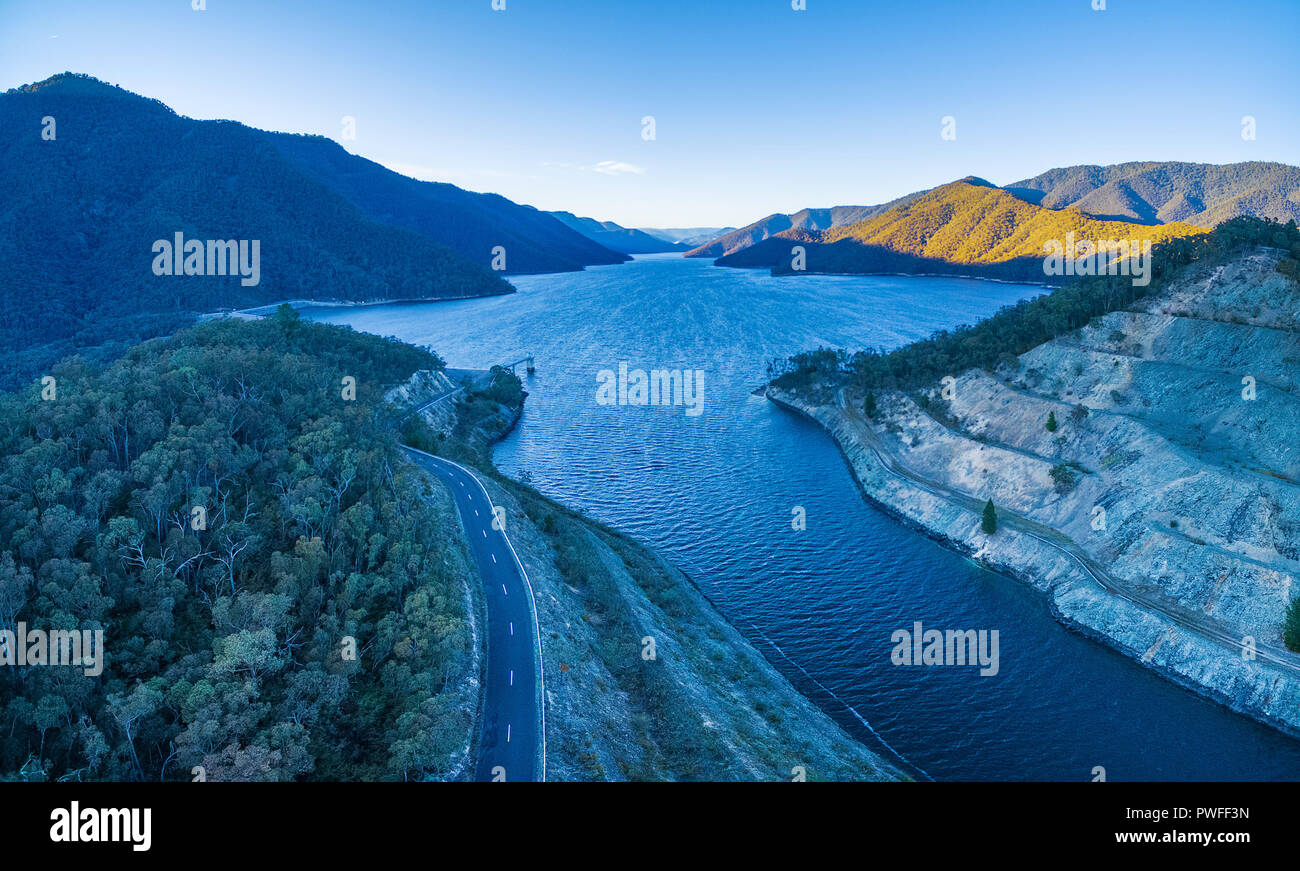 Aerial panorama of Talbingo Reservoir lake among scenic hills at sunset ...