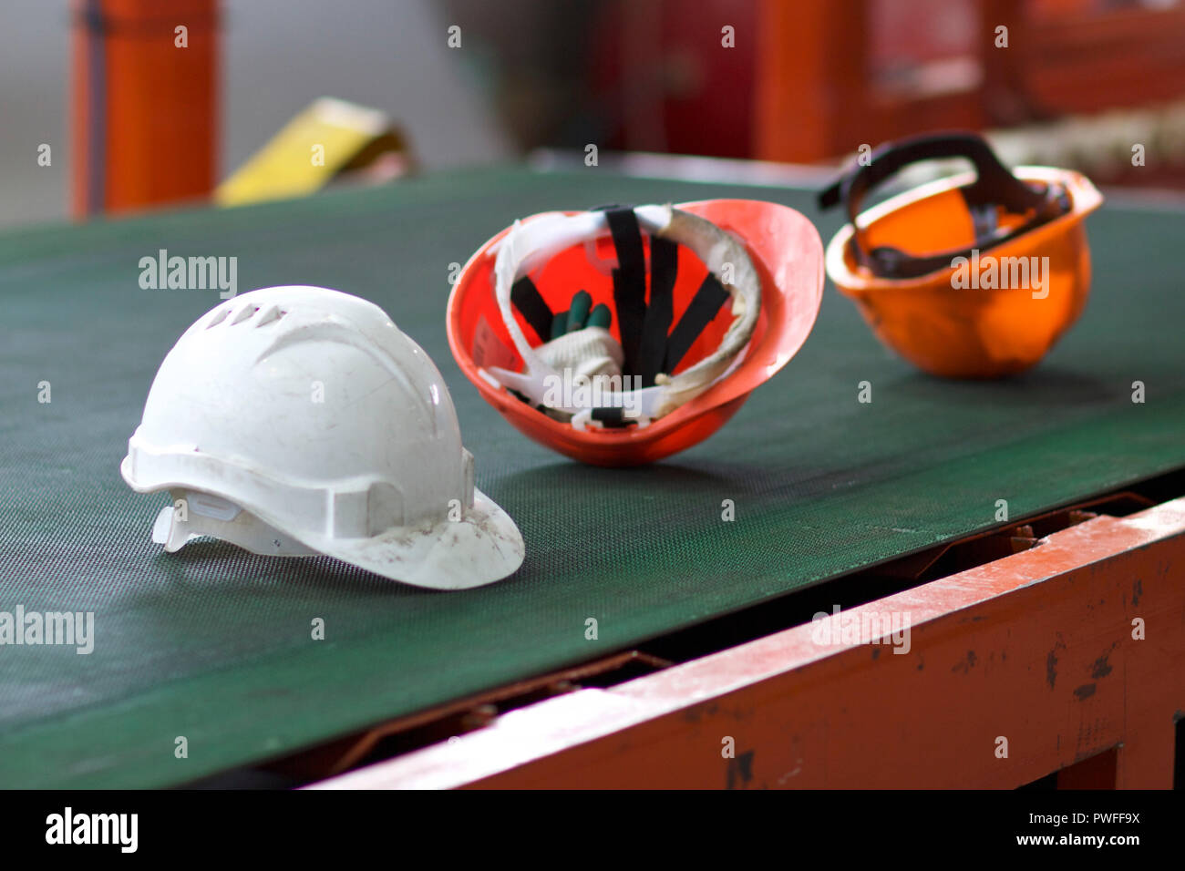 Construction helmets of different colors are waiting for the owners ...