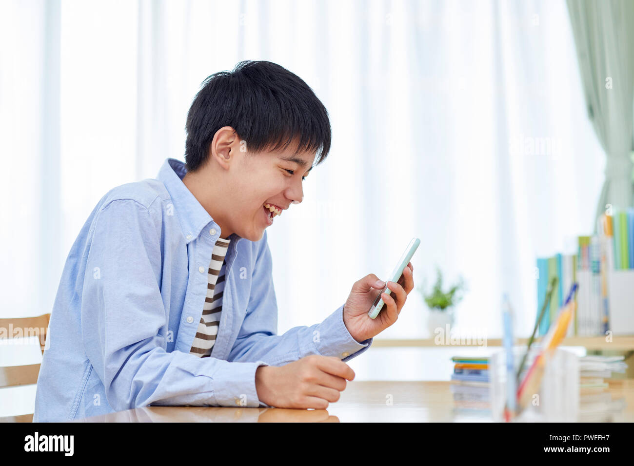 Japanese kid studying at home Stock Photo - Alamy