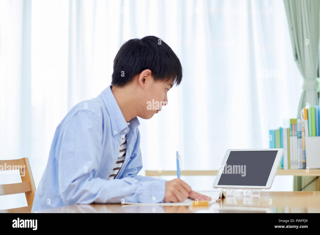 Japanese kid studying at home Stock Photo - Alamy